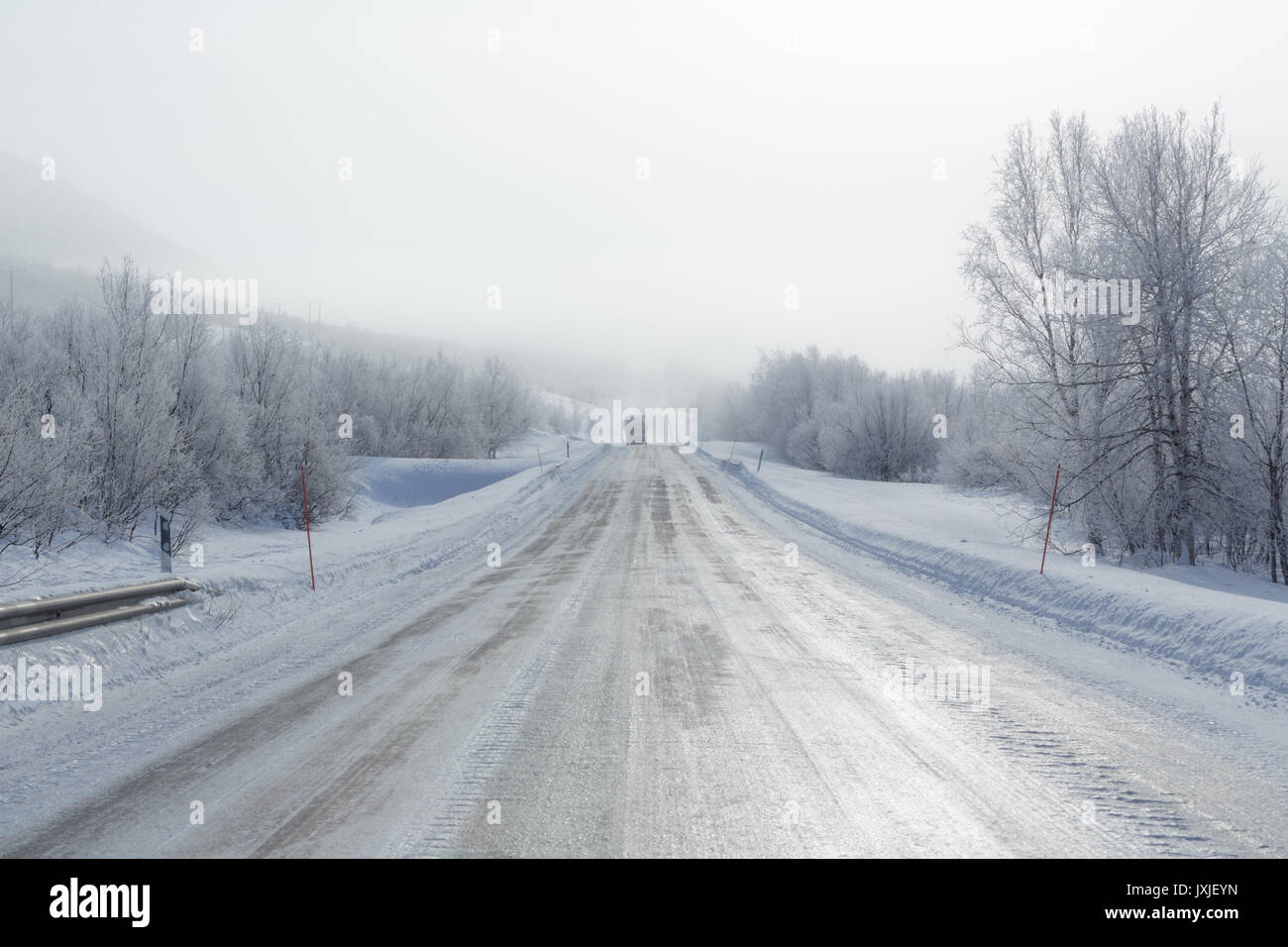 Snow covered land and road in scandinavia Stock Photo - Alamy