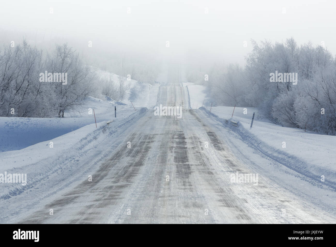 Snow covered land and road in scandinavia Stock Photo - Alamy