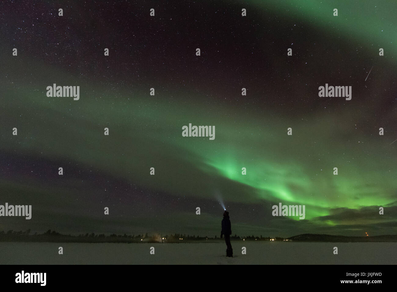 Frozen land in scandinavia and Aurora in the sky Stock Photo - Alamy