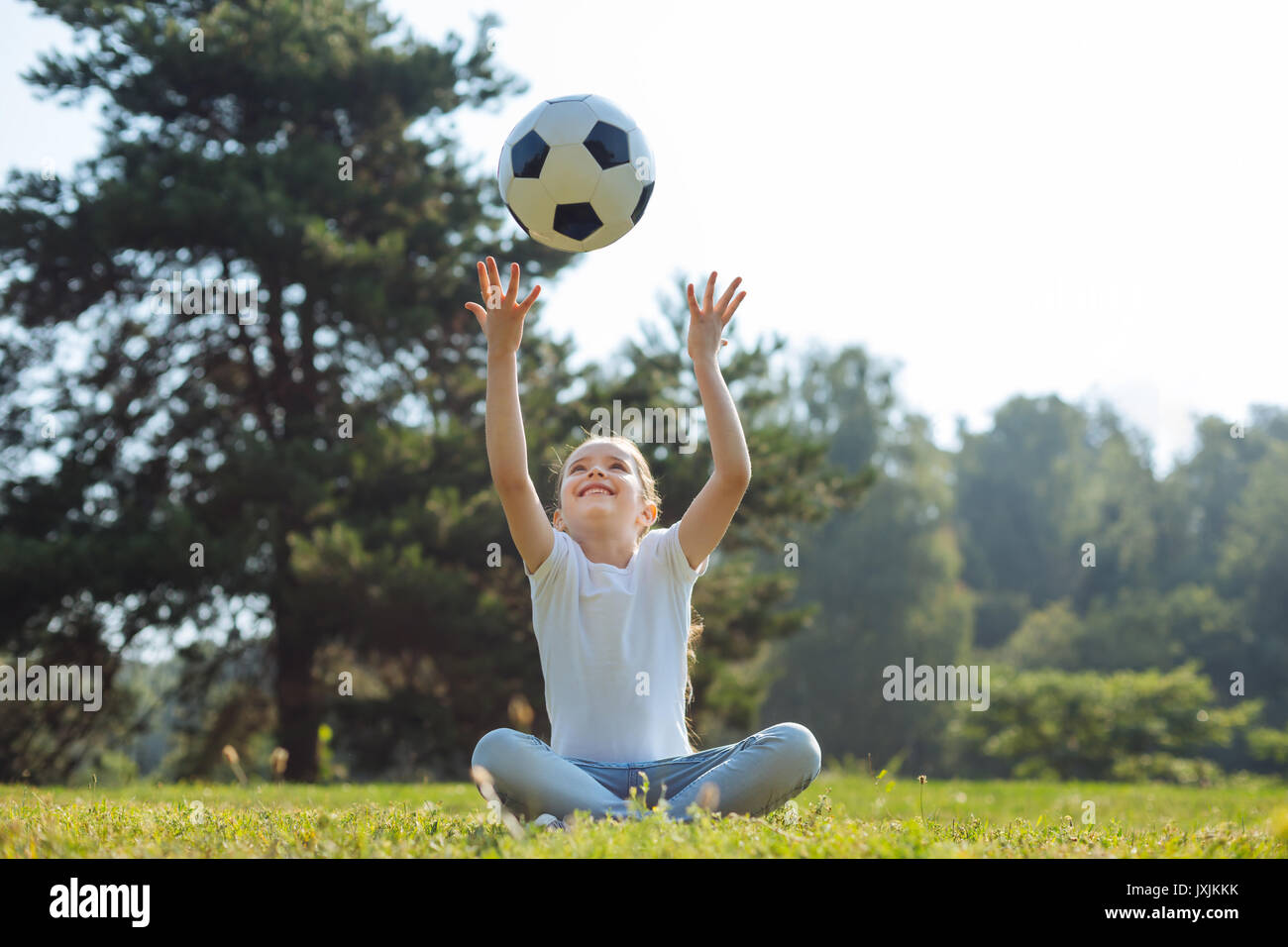 Girl Throwing Ball In The Air High Resolution Stock Photography and ...