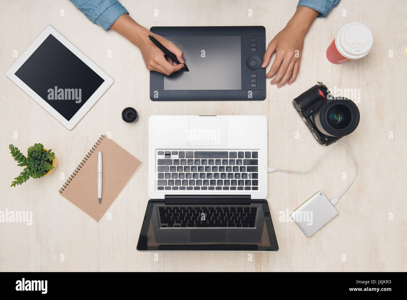 Graphic designer working with digital tablet at desk. Top view Stock ...