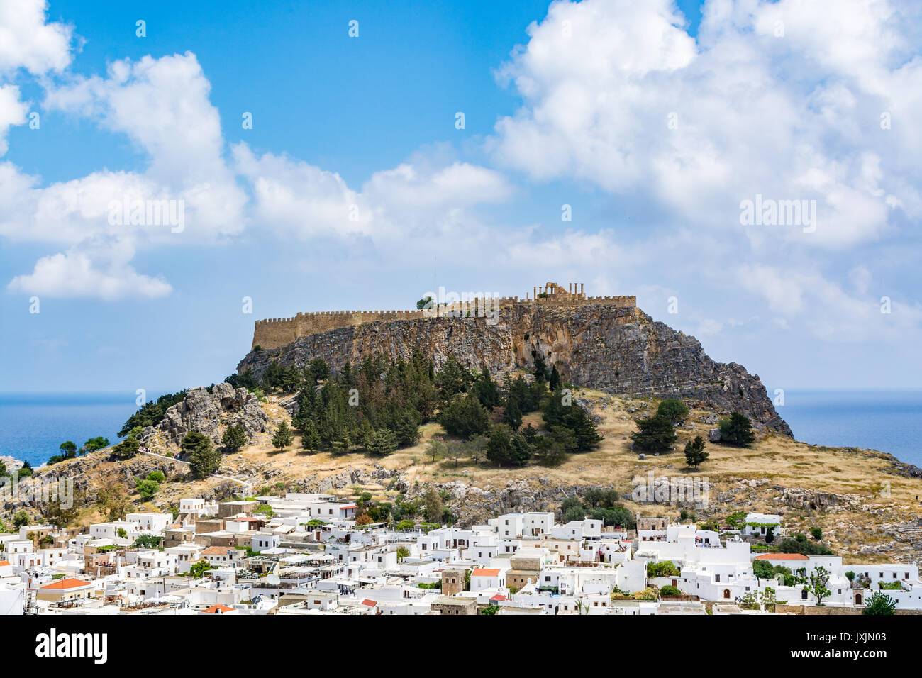 Lindos cityscape and view of the Lindos castle on a beautiful day ...