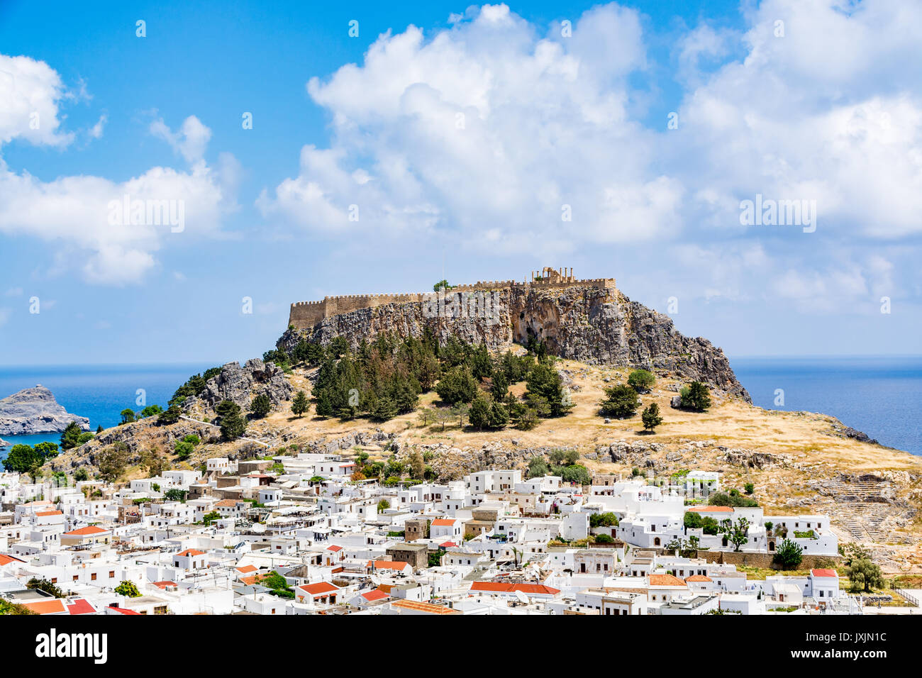 Lindos cityscape and view of the Lindos castle on a beautiful day ...