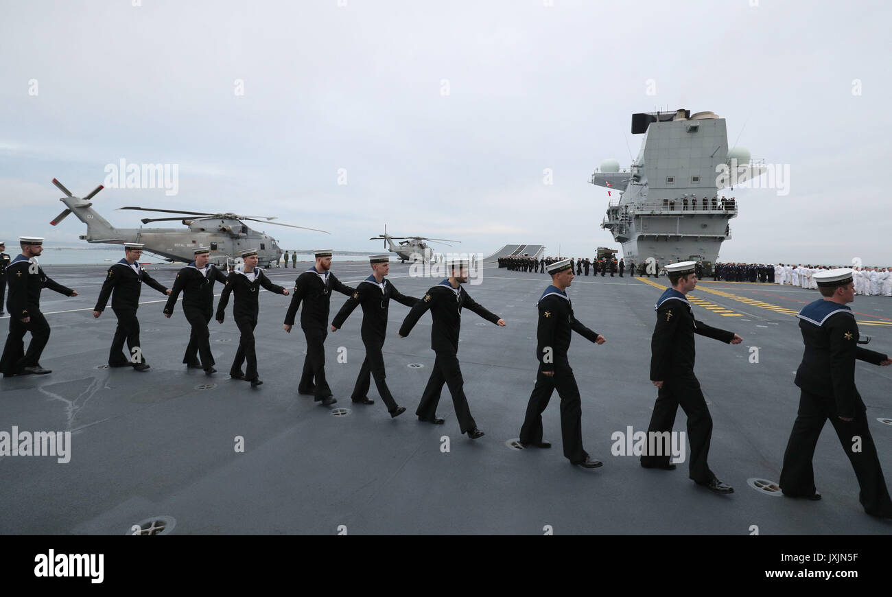 Ratings march into position on the flight deck of HMS Queen Elizabeth ...