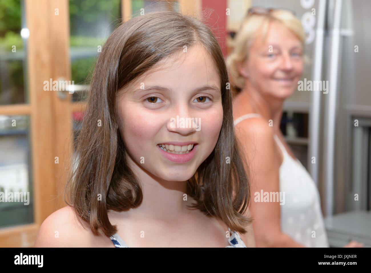 a portrait of pretty beautiful young girl, mother background Stock ...