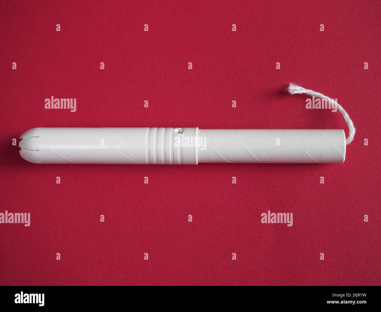 Tampon with red background Stock Photo - Alamy