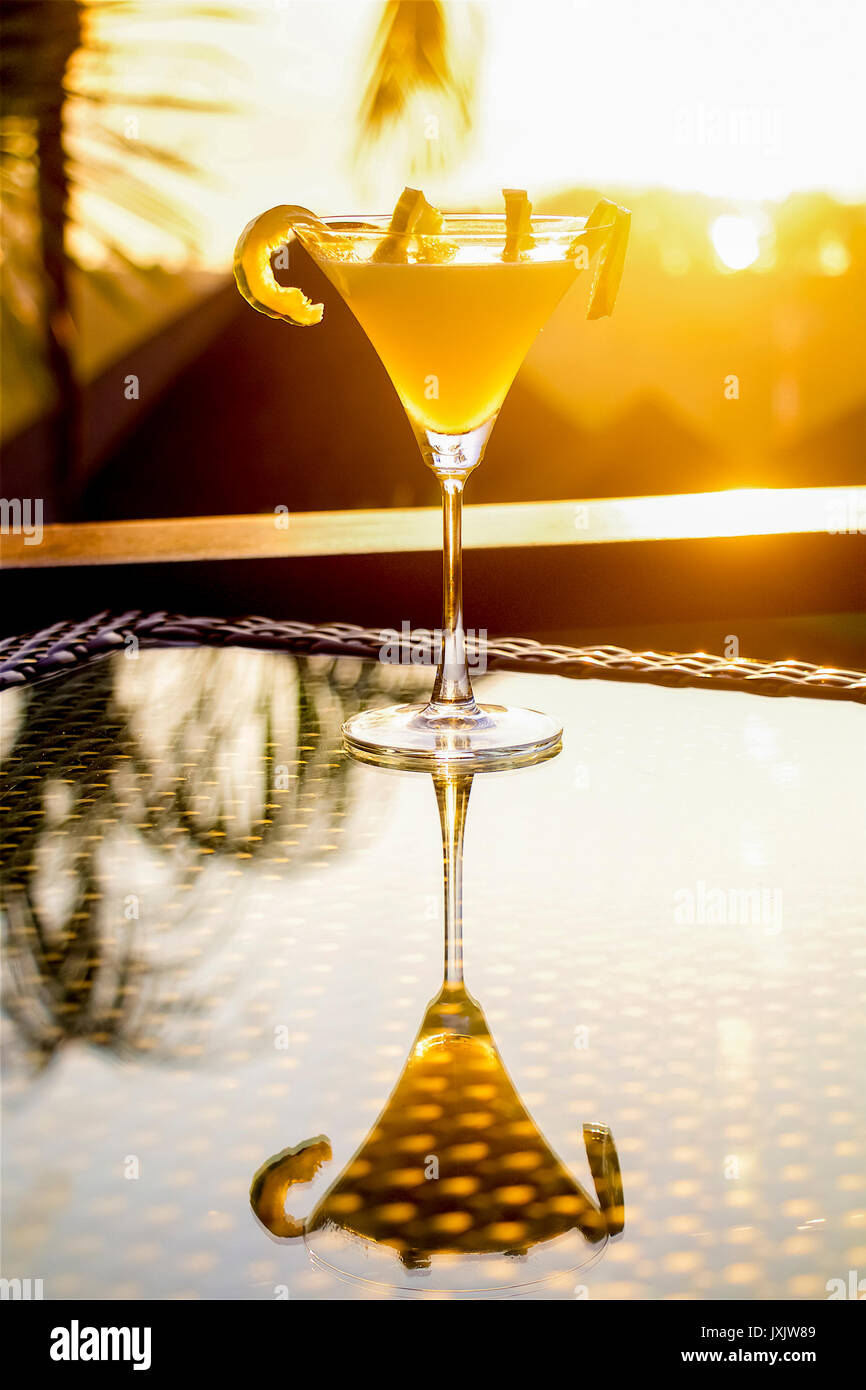 Martini fresh fruit cocktail drink at sunset in a luxury resort in ...