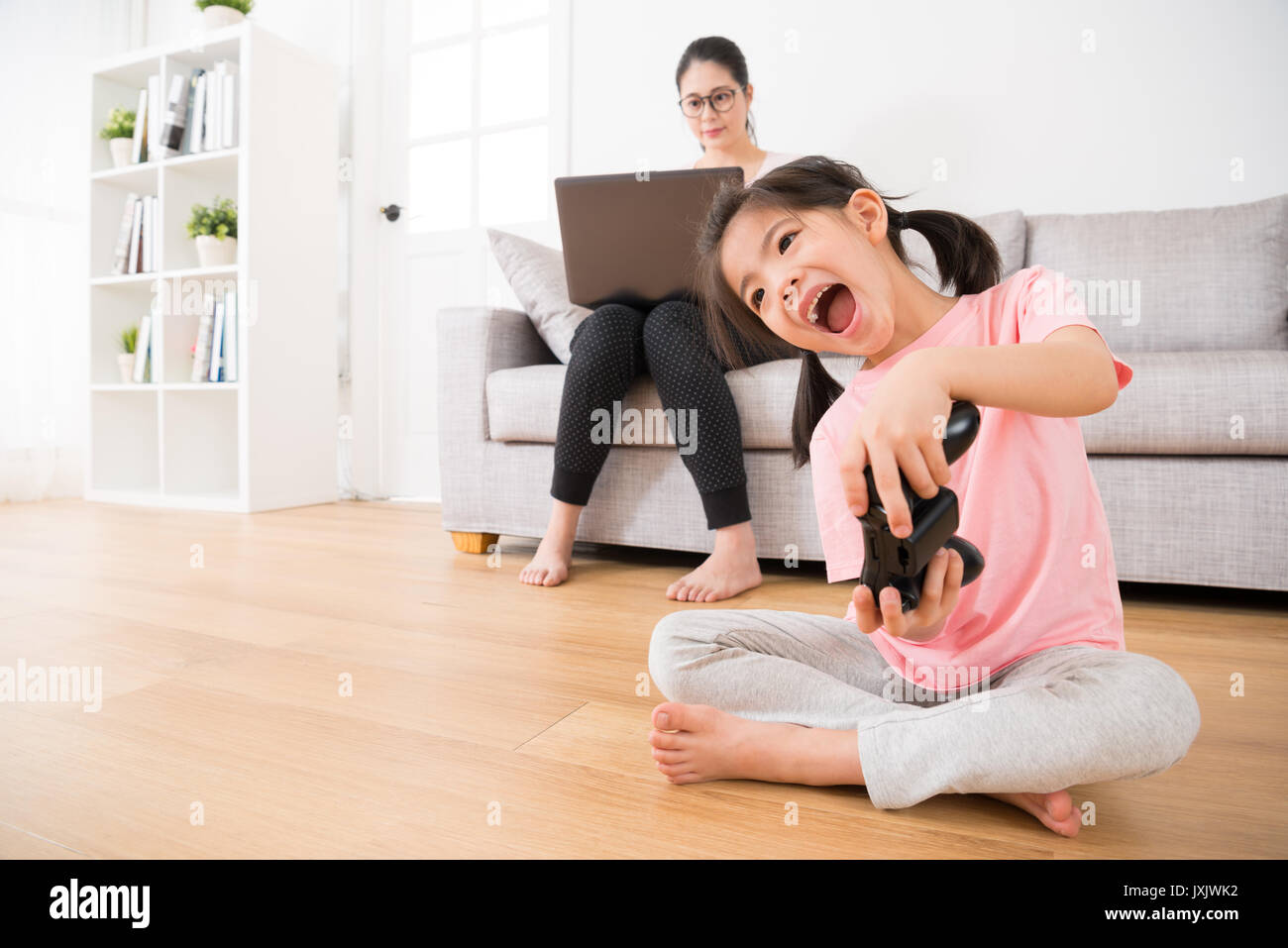 excited sweet little girl children happy holding joystick controller ...