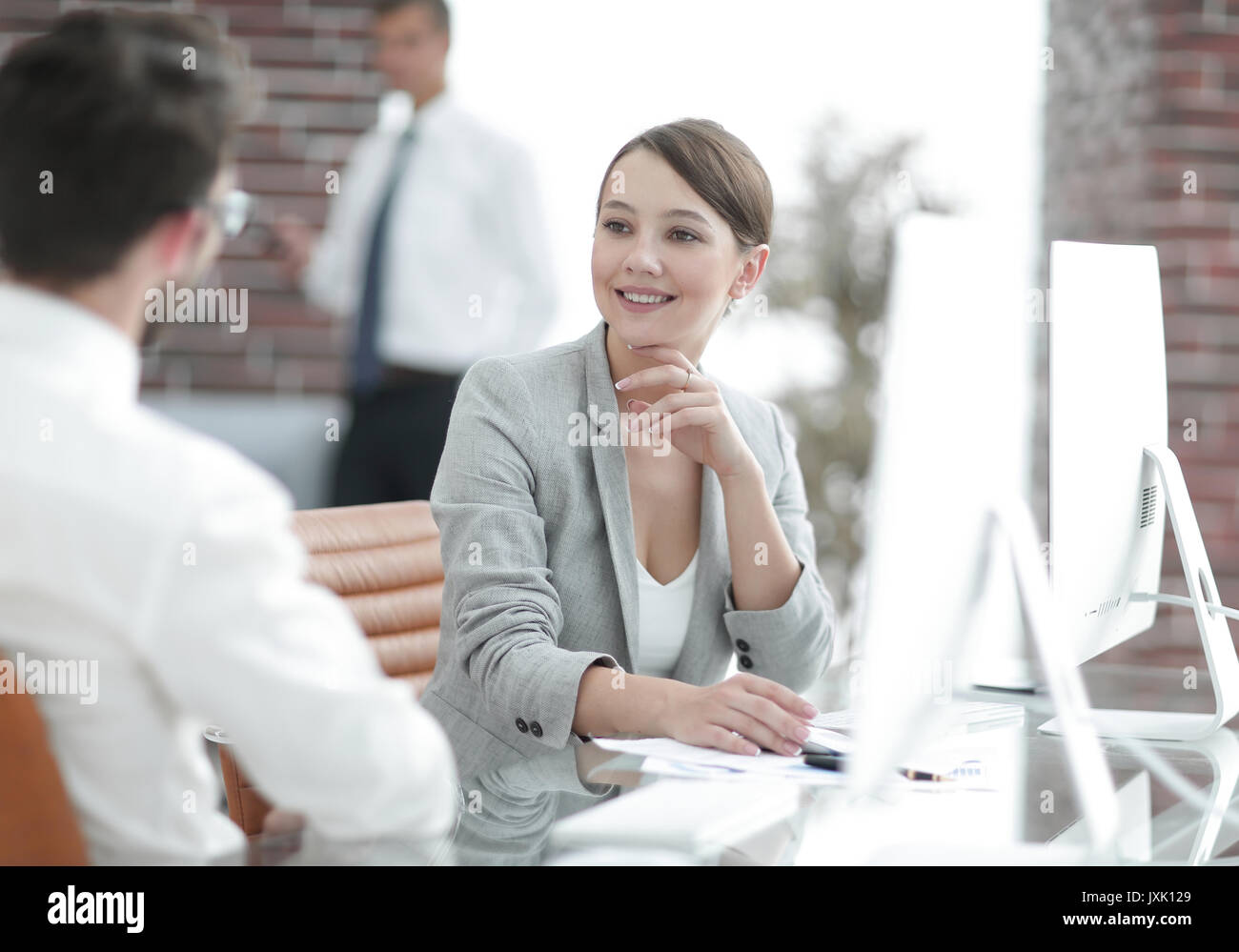 Business people looking project reports hi-res stock photography and ...