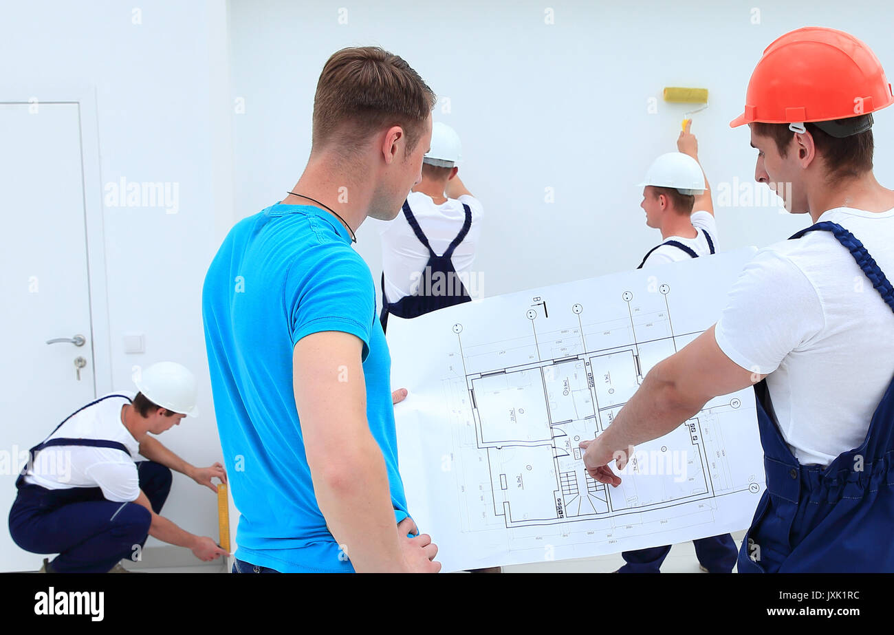 Architect client discussing plan hi-res stock photography and images ...
