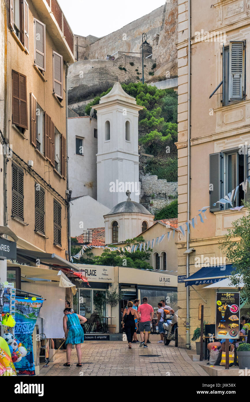 Narrow alley and St Erasmus church in Bonifacio town, south Corsica ...