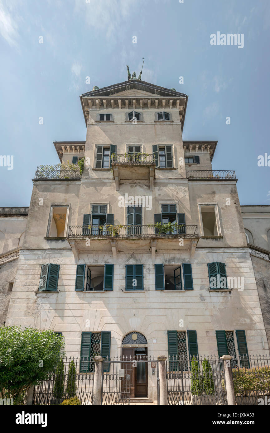 facade of Abbey building on little island at Orta lake, shot on bright ...