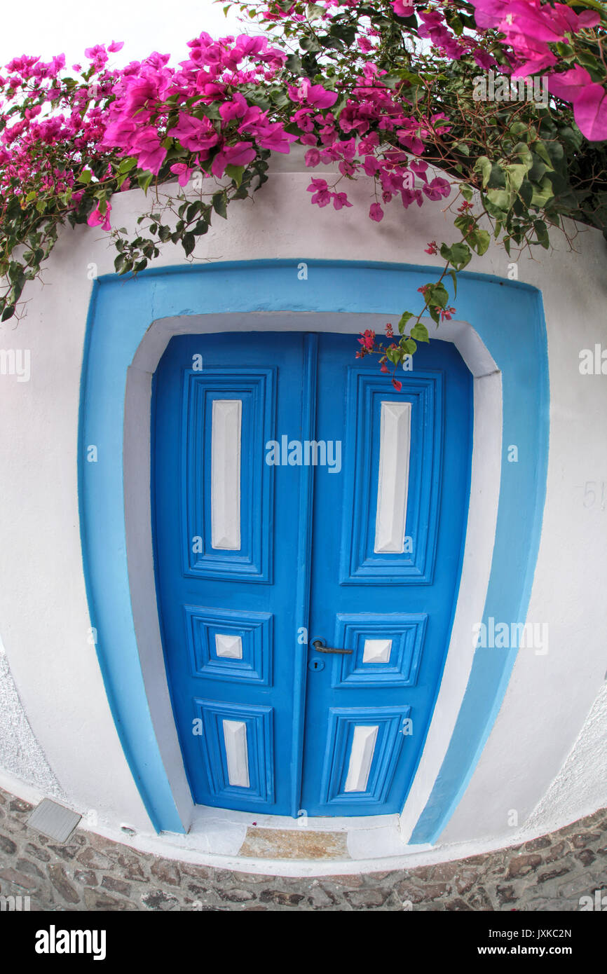 Traditional greek door with flowers in Oia village on Santorini island ...