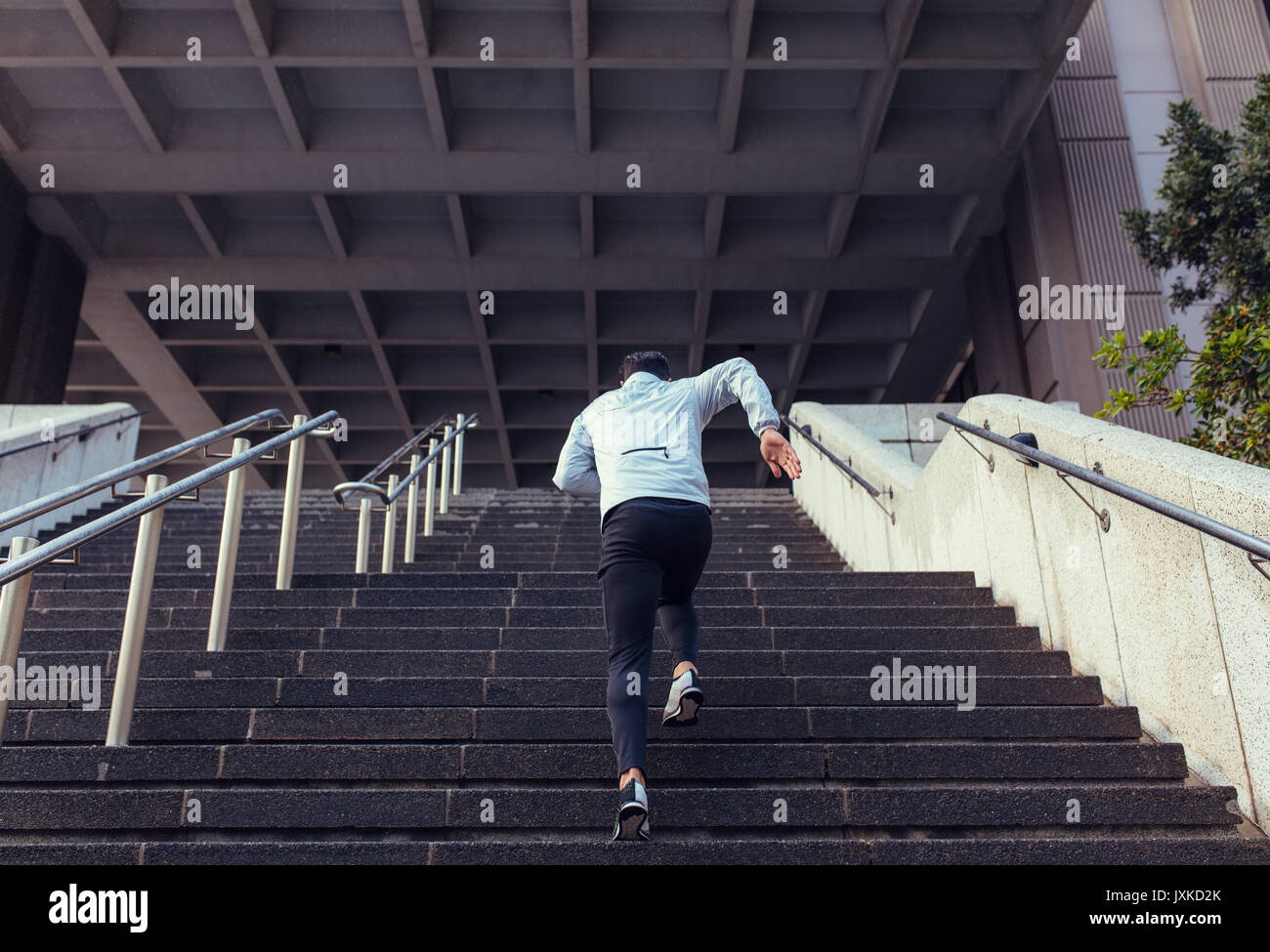 Man running up stairs hi-res stock photography and images - Alamy