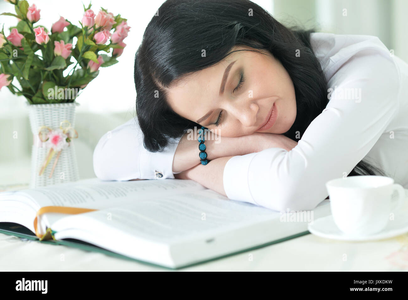 woman sleeping on book Stock Photo - Alamy