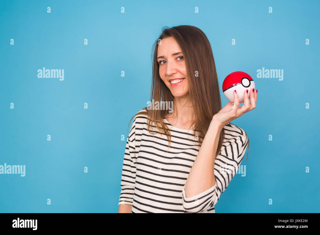 Ufa, Russia - July 8, 2017: woman holding pokeball with pikachu ...