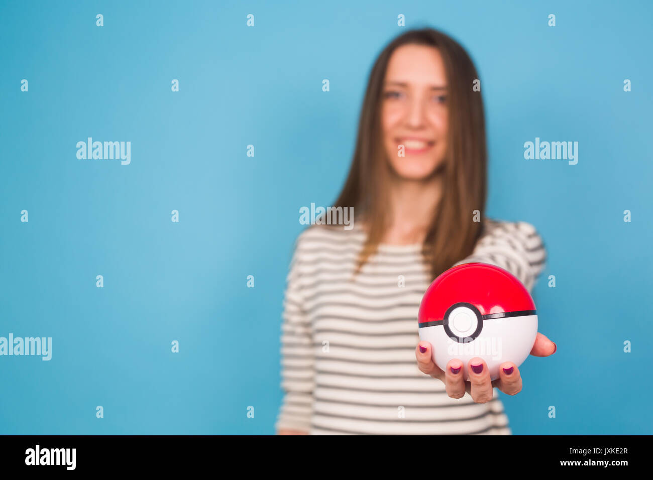 Ufa, Russia - July 8, 2017: woman holding pokeball with pikachu ...