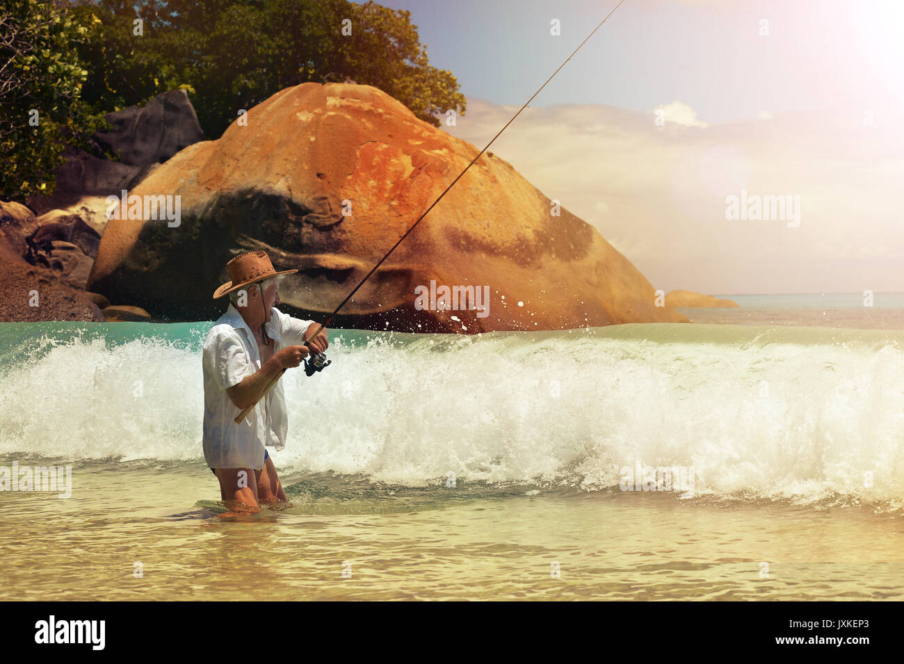 Senior man fishing Stock Photo - Alamy