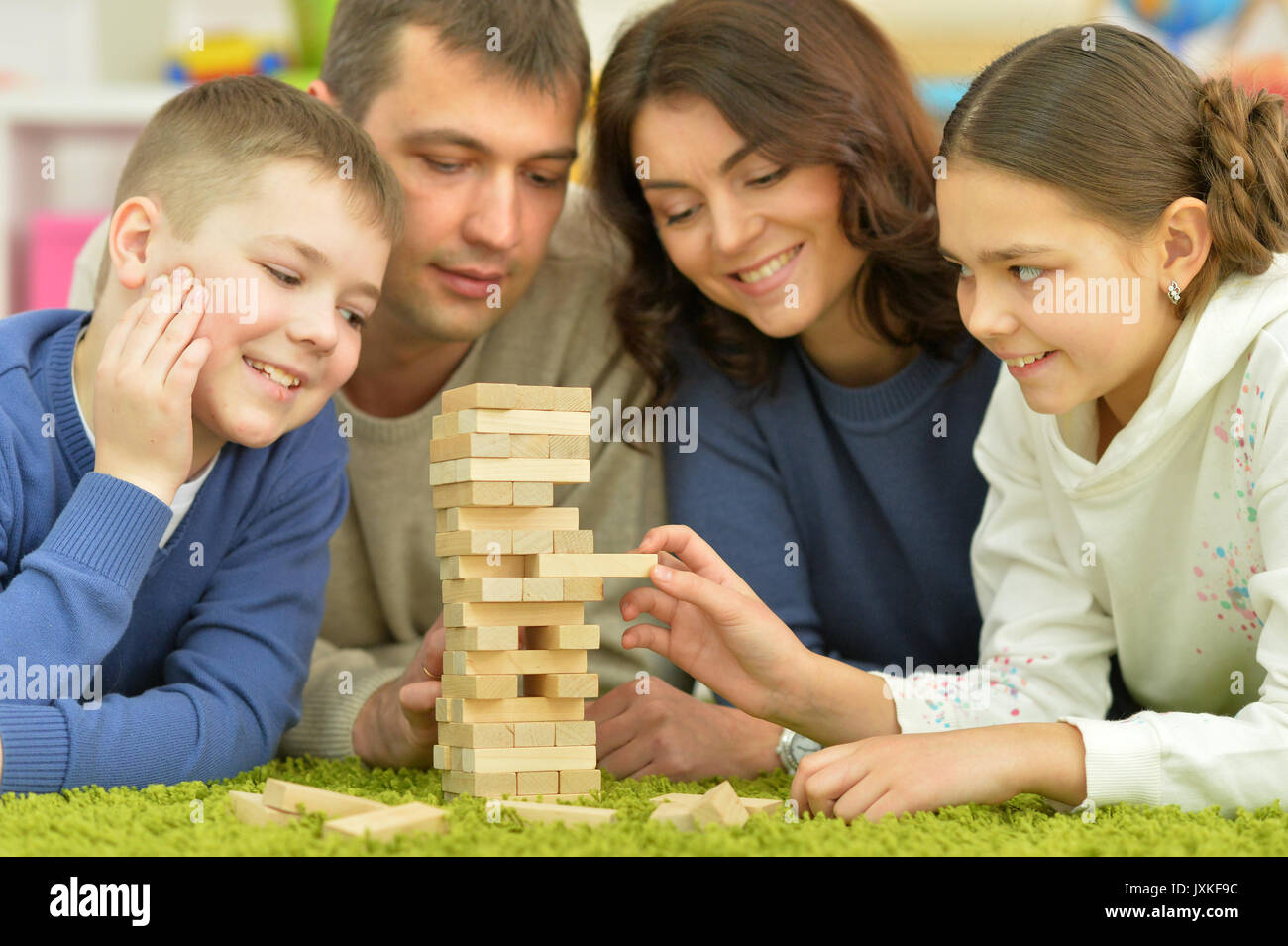 parents and children playing with blocks Stock Photo - Alamy