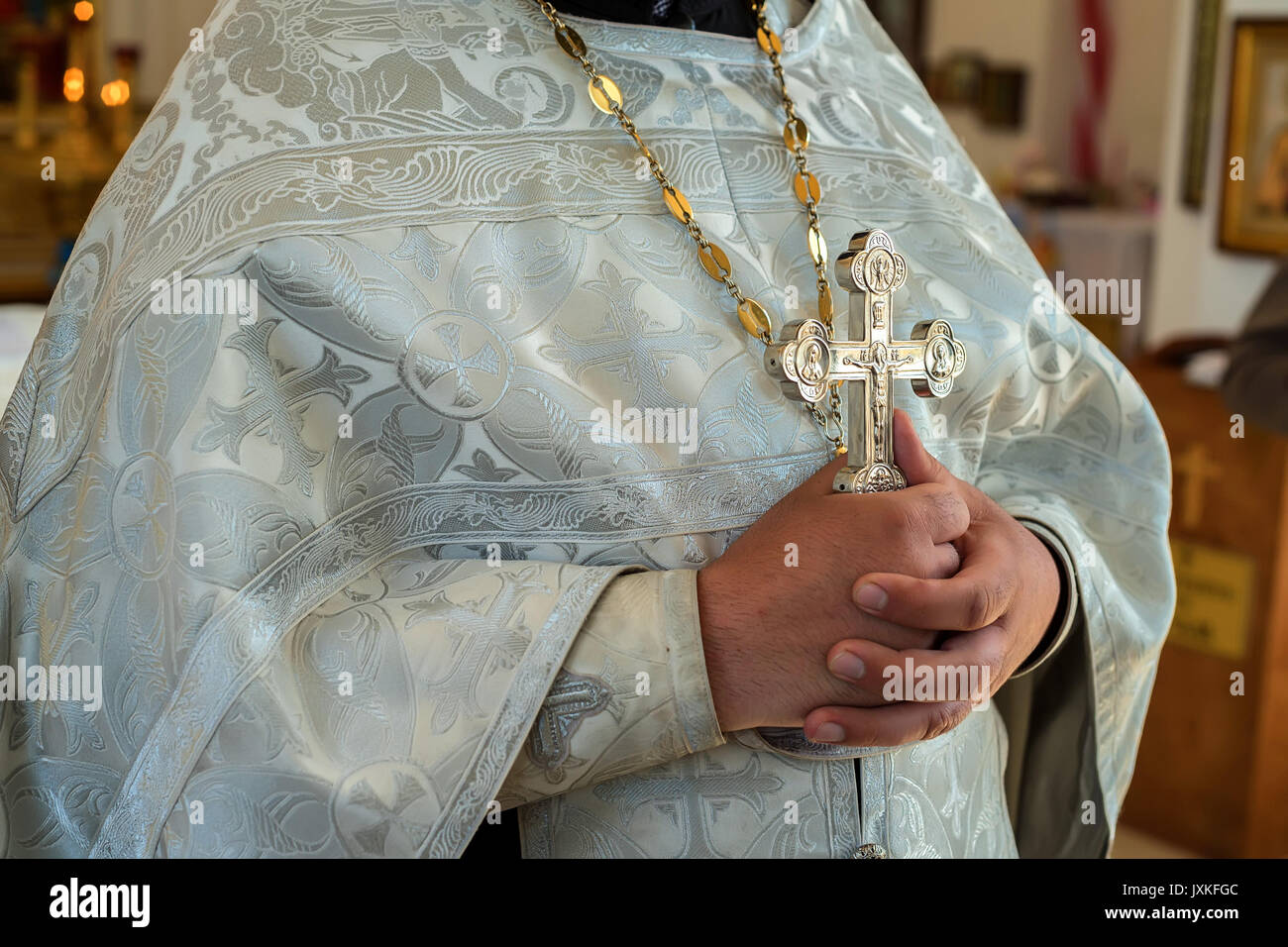 Orthodox christian priest holds cross Stock Photo - Alamy