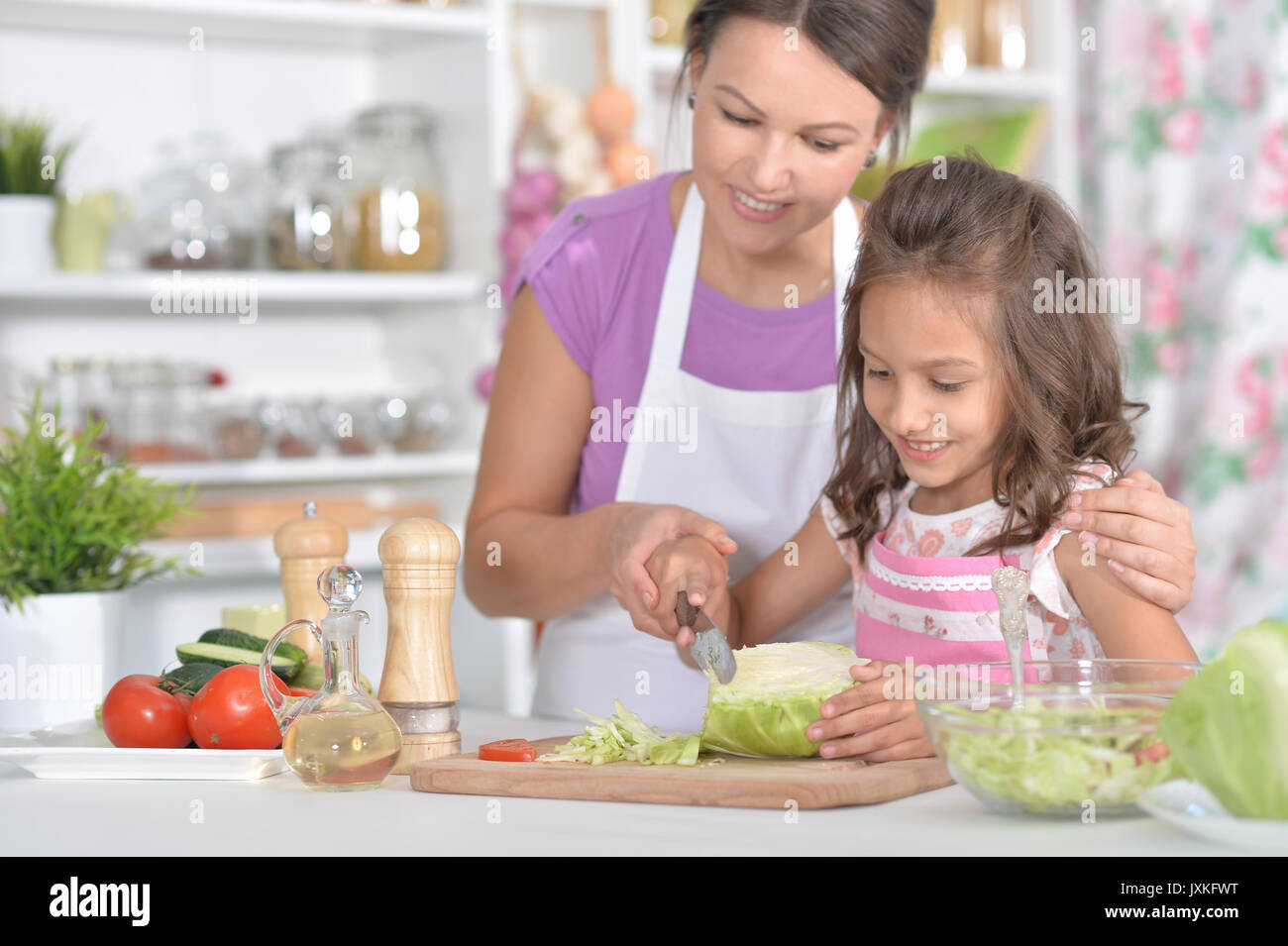 Mother and daughter preparing dinner Stock Photo - Alamy