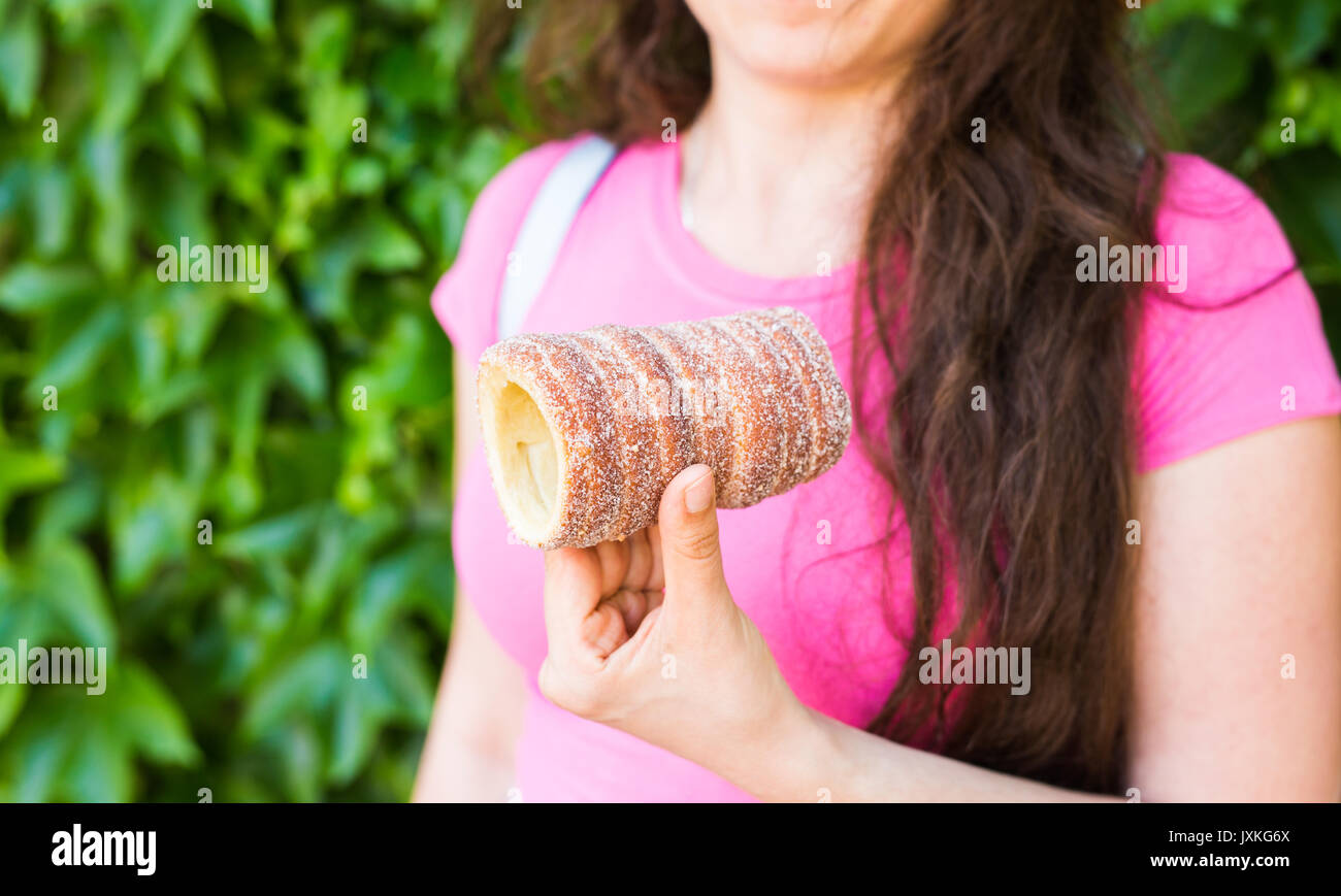 Close Up Of Young Female Tourist With Traditional Czech Dessert