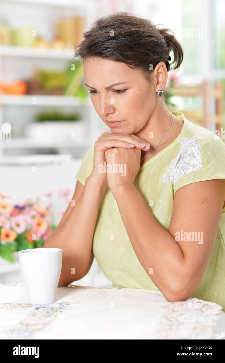 Sad young female cup tea hi-res stock photography and images - Alamy