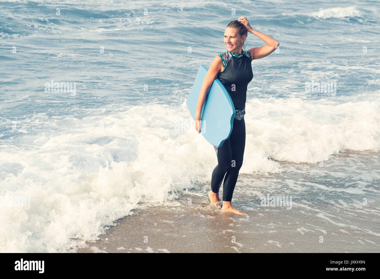 Lady swimming wetsuit hi-res stock photography and images - Alamy