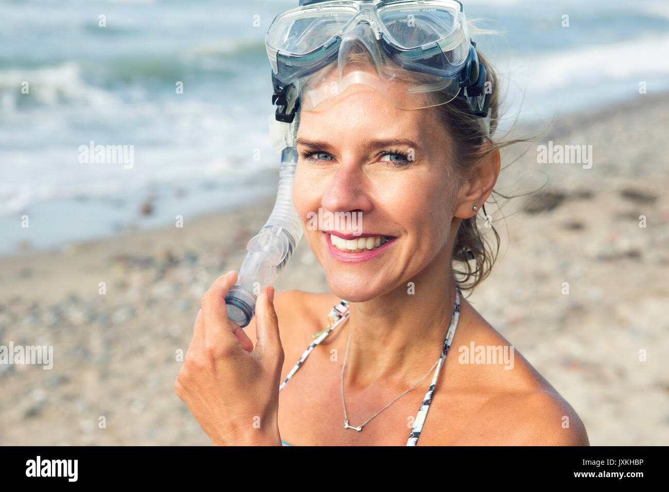 portrait of beautiful woman on the beach with swimming goggles Stock ...