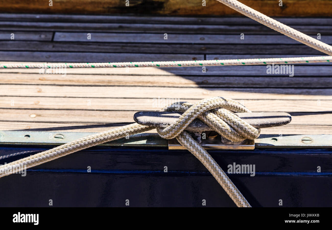 Nautical Line tied to Cleat on Dock Stock Photo - Alamy