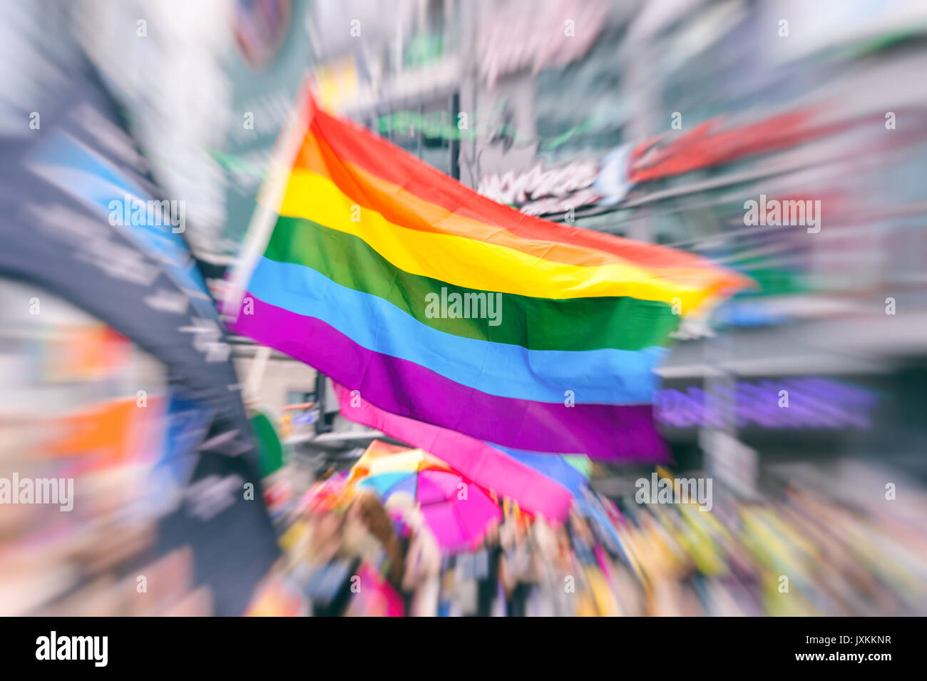 Motion blurred picture of gay rainbow flags during pride parade ...