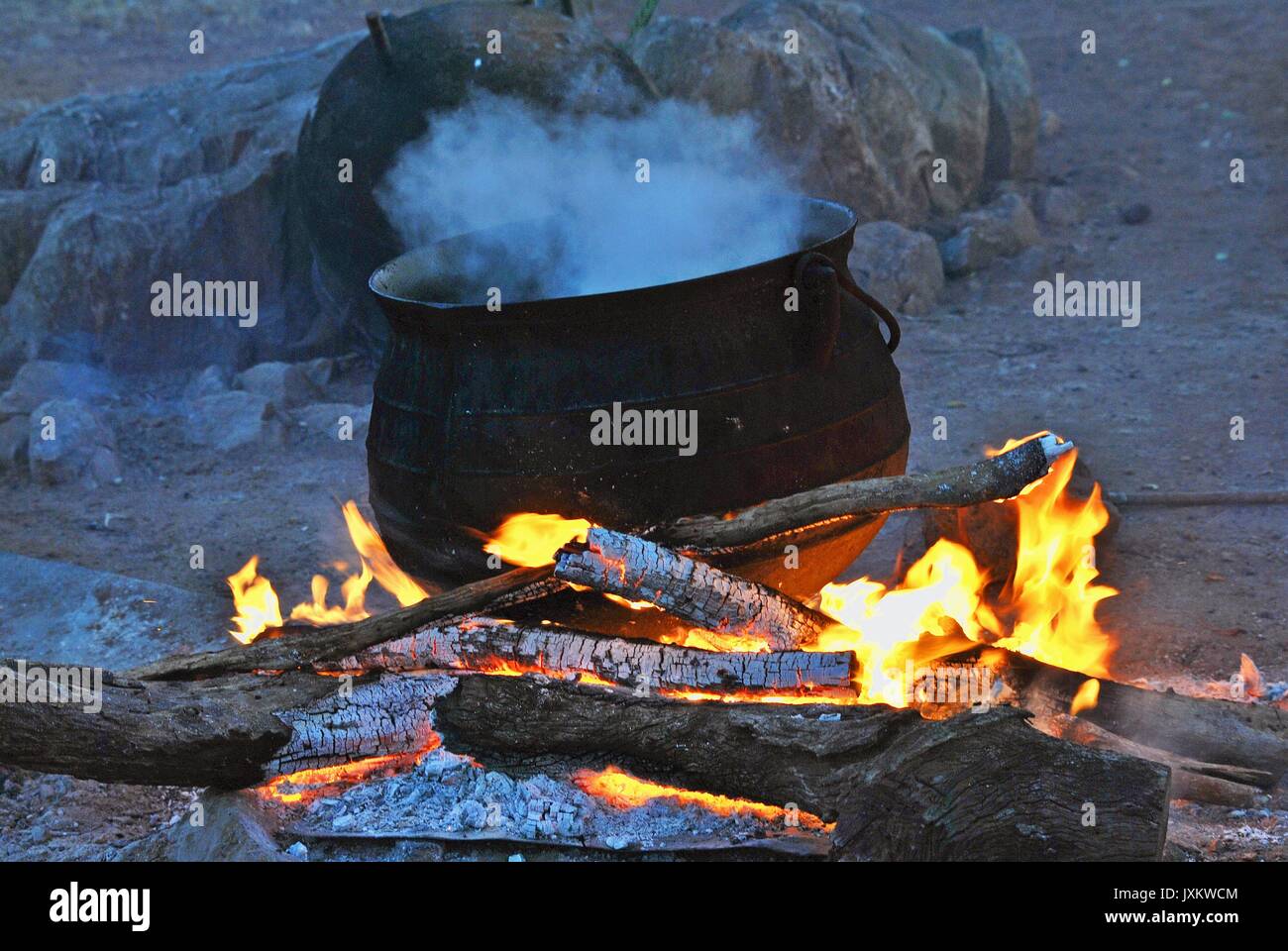 A traditional 3 legged cast iron pot Stock Photo - Alamy