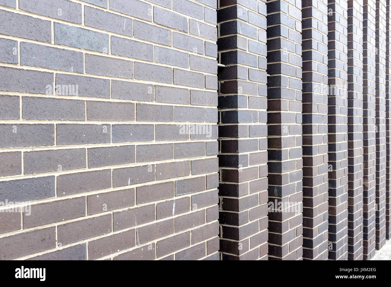 A modern brick wall with vertical inserts shot at an angle Stock Photo ...