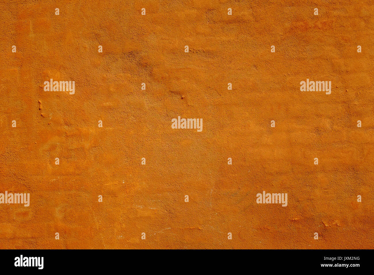Deep orange.burnt umber painted brick wall Stock Photo - Alamy