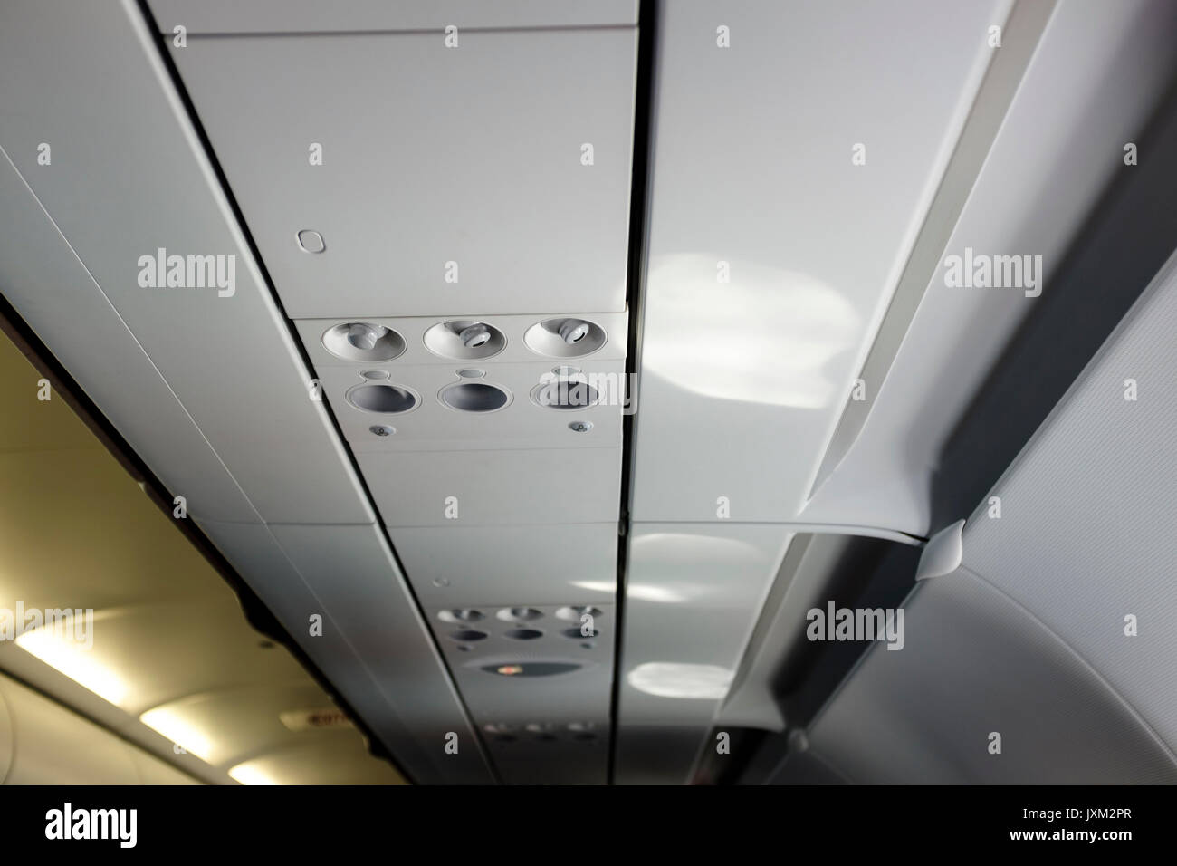 Interior of an aeroplane cabin showing the light, ventilation ...