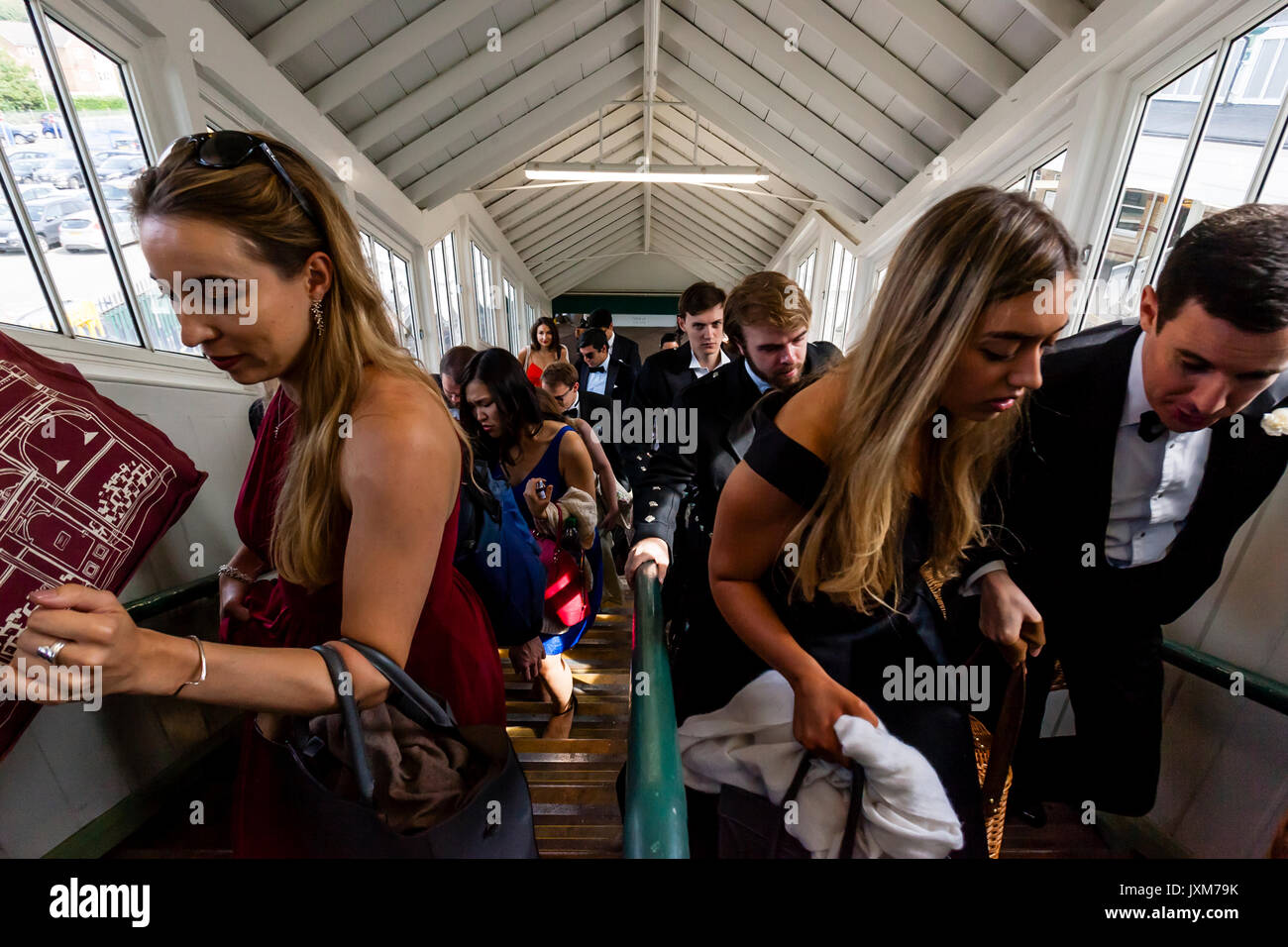 Young opera fans arrive at Lewes train station en route to Glyndebourne ...