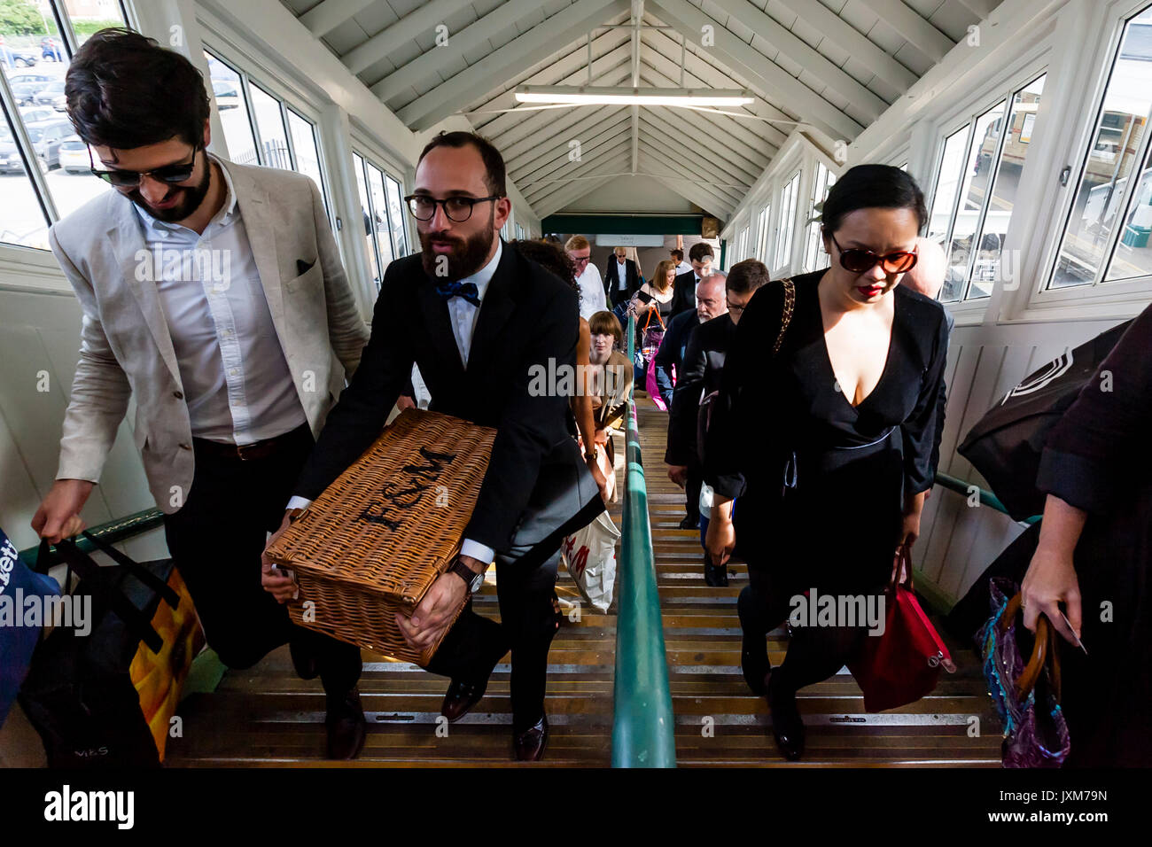 Young opera fans arrive at Lewes train station en route to Glyndebourne ...