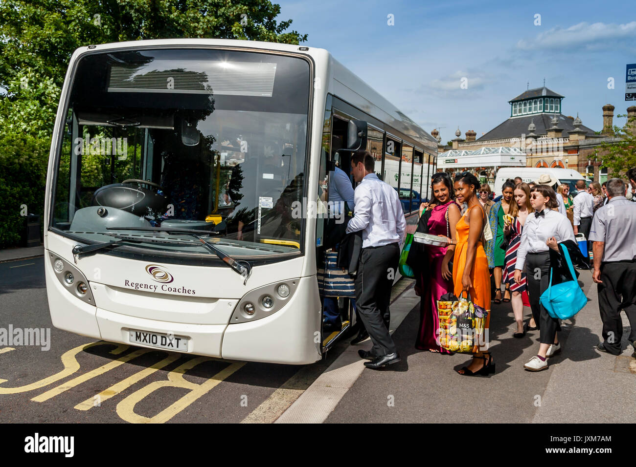 Young opera fans boarding a bus to Glyndebourne Opera House for a ...