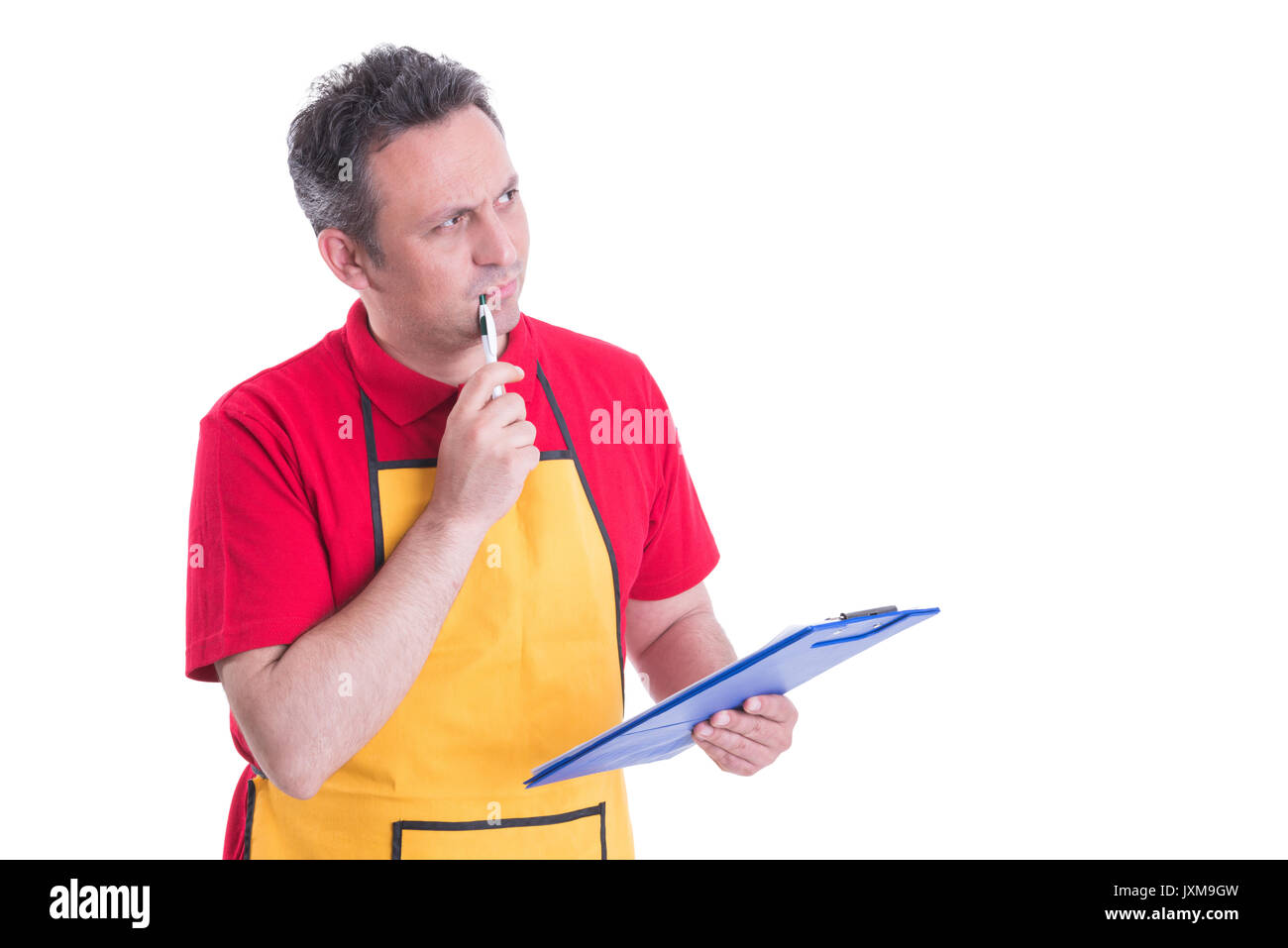 Pensive employee with clipboard looking doubtful and thinking at ...