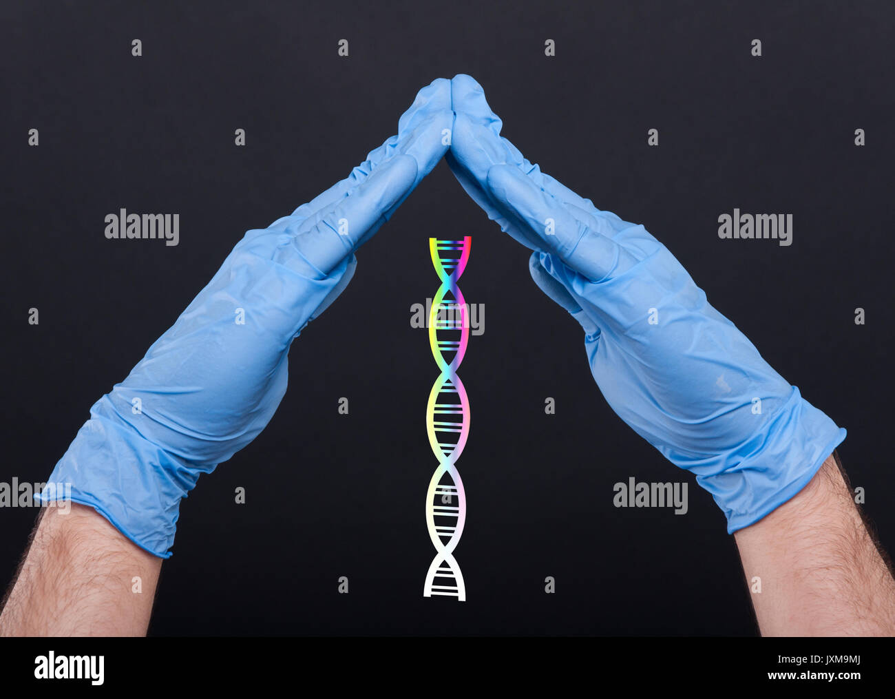 Hand of doctor or medic holding dna molecule concept on black ...