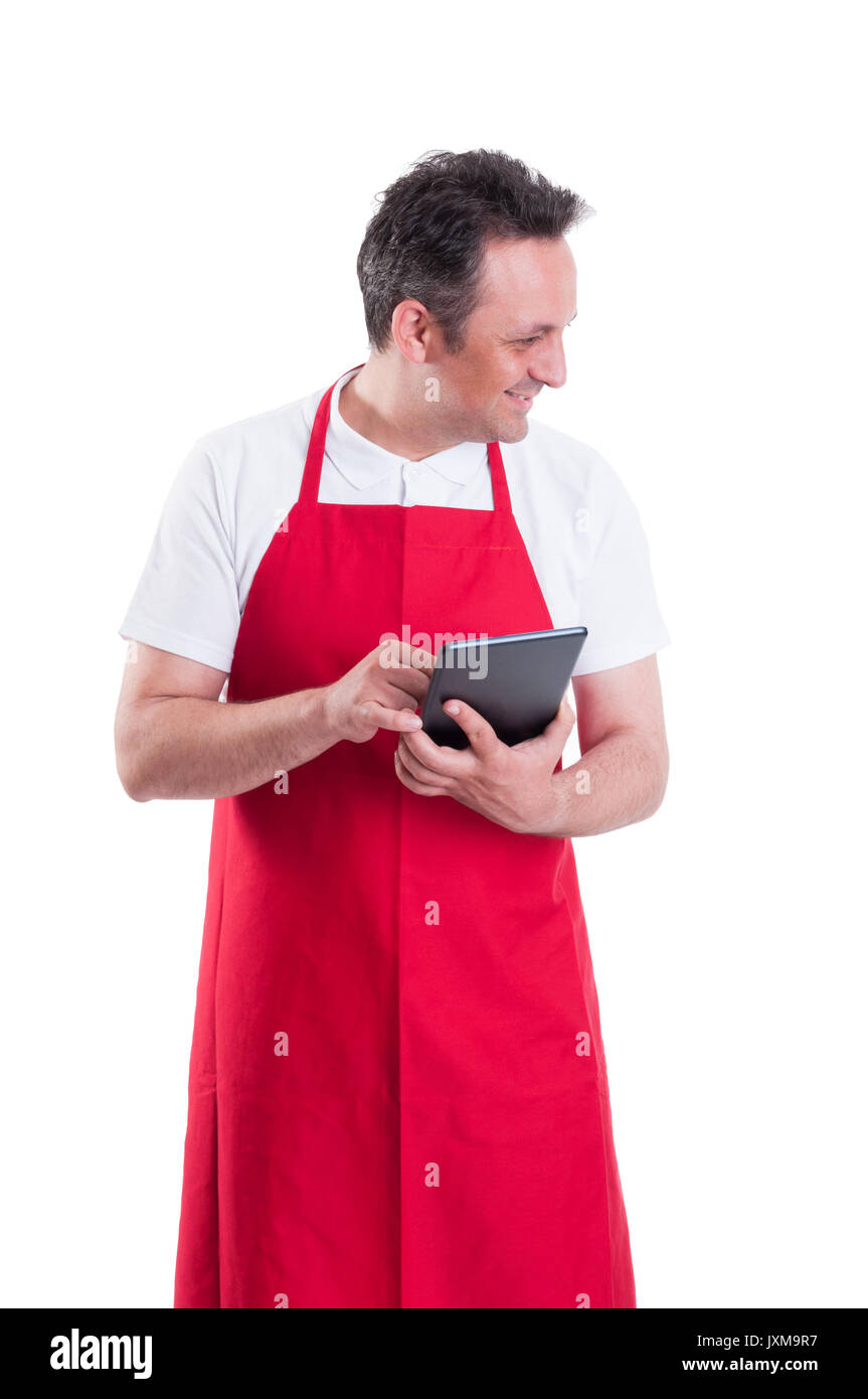 Professional supermarket retailer working with digital tablet and ...