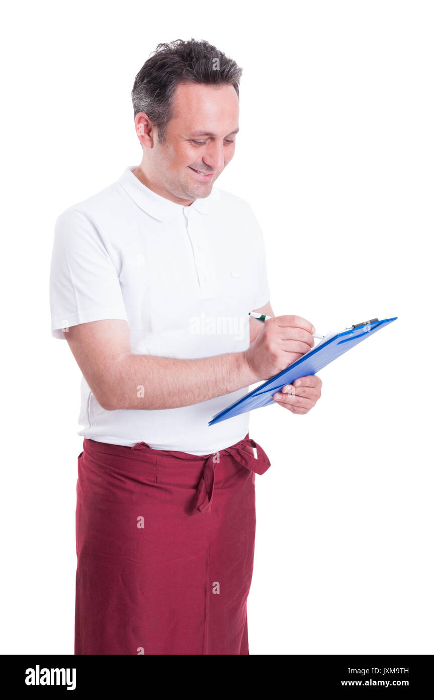 Successful butcher with clipboard taking notes and smiling on white ...