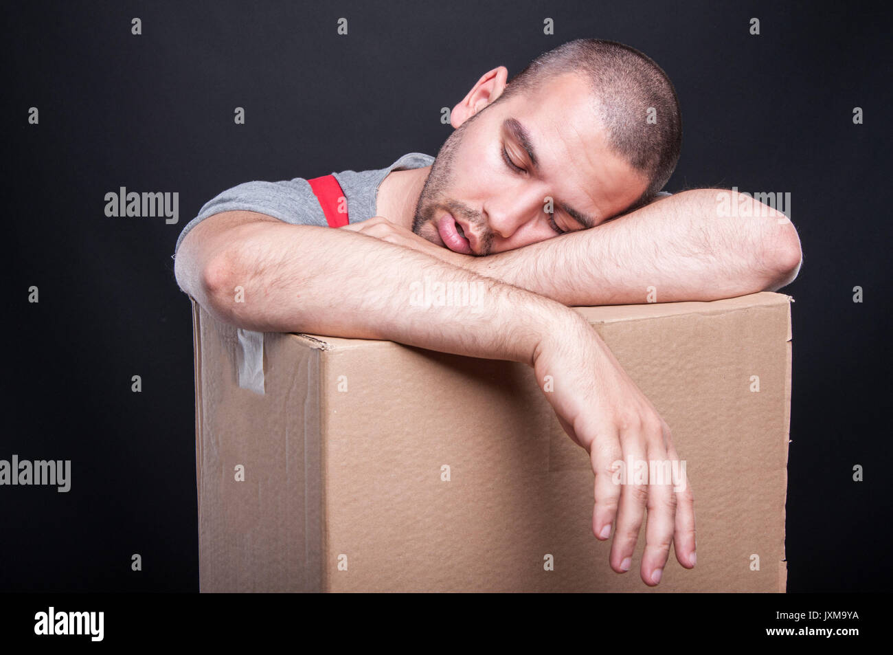 Tired delivery man box hi-res stock photography and images - Alamy