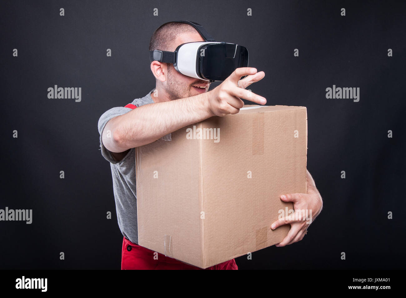 Mover guy holding box grabbing something wearing vr glasses on black ...