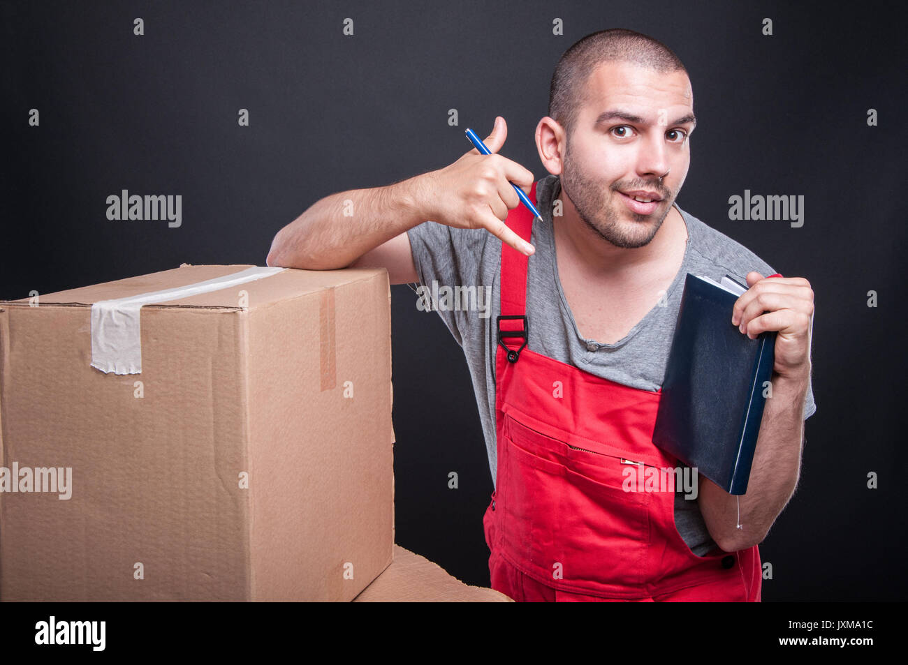 Mover guy holding agenda making calling gesture looking busy on black ...
