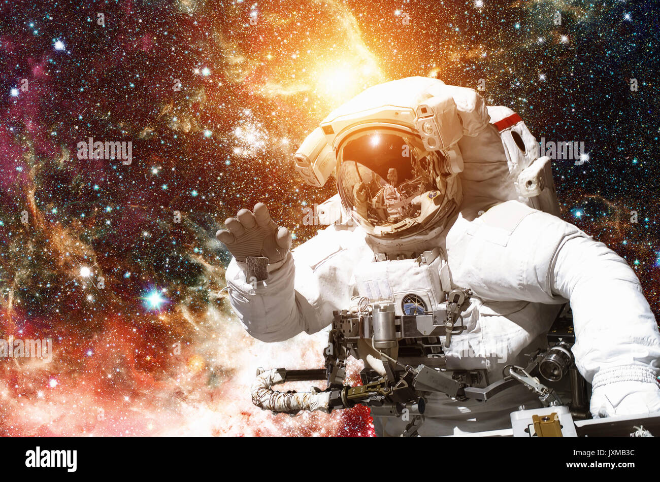 Astronaut in outer space. Galaxy and stars on the background. Elements ...
