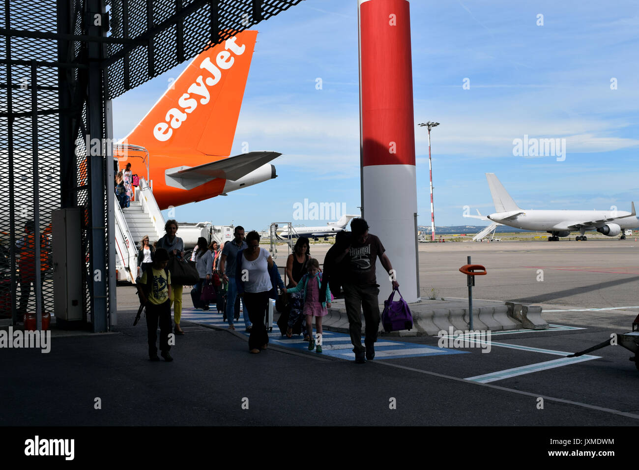 Easyjet Airbus aircraft is seen through wire mesh as passengers ...