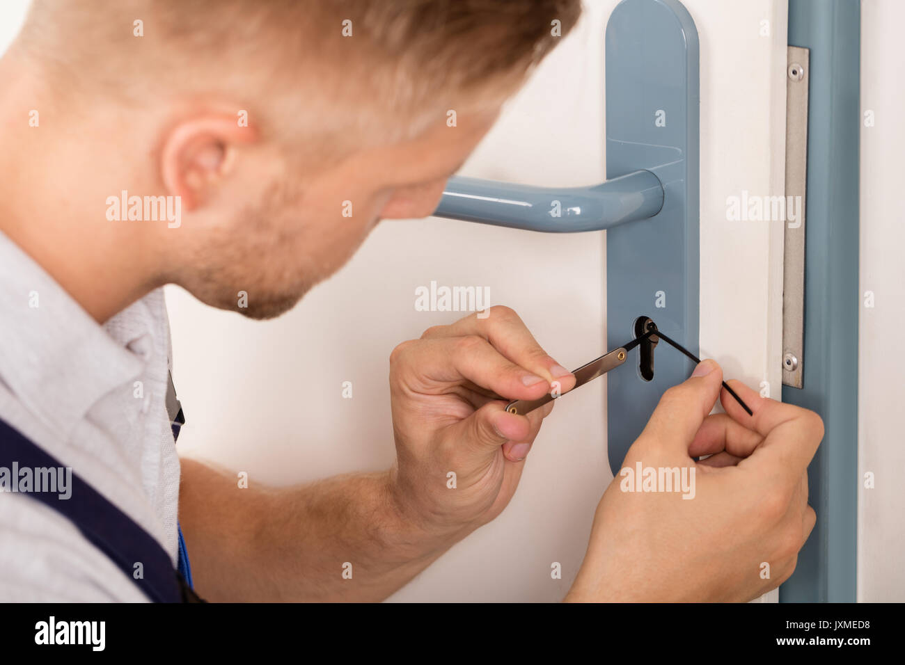 Man opening lock hi-res stock photography and images - Alamy
