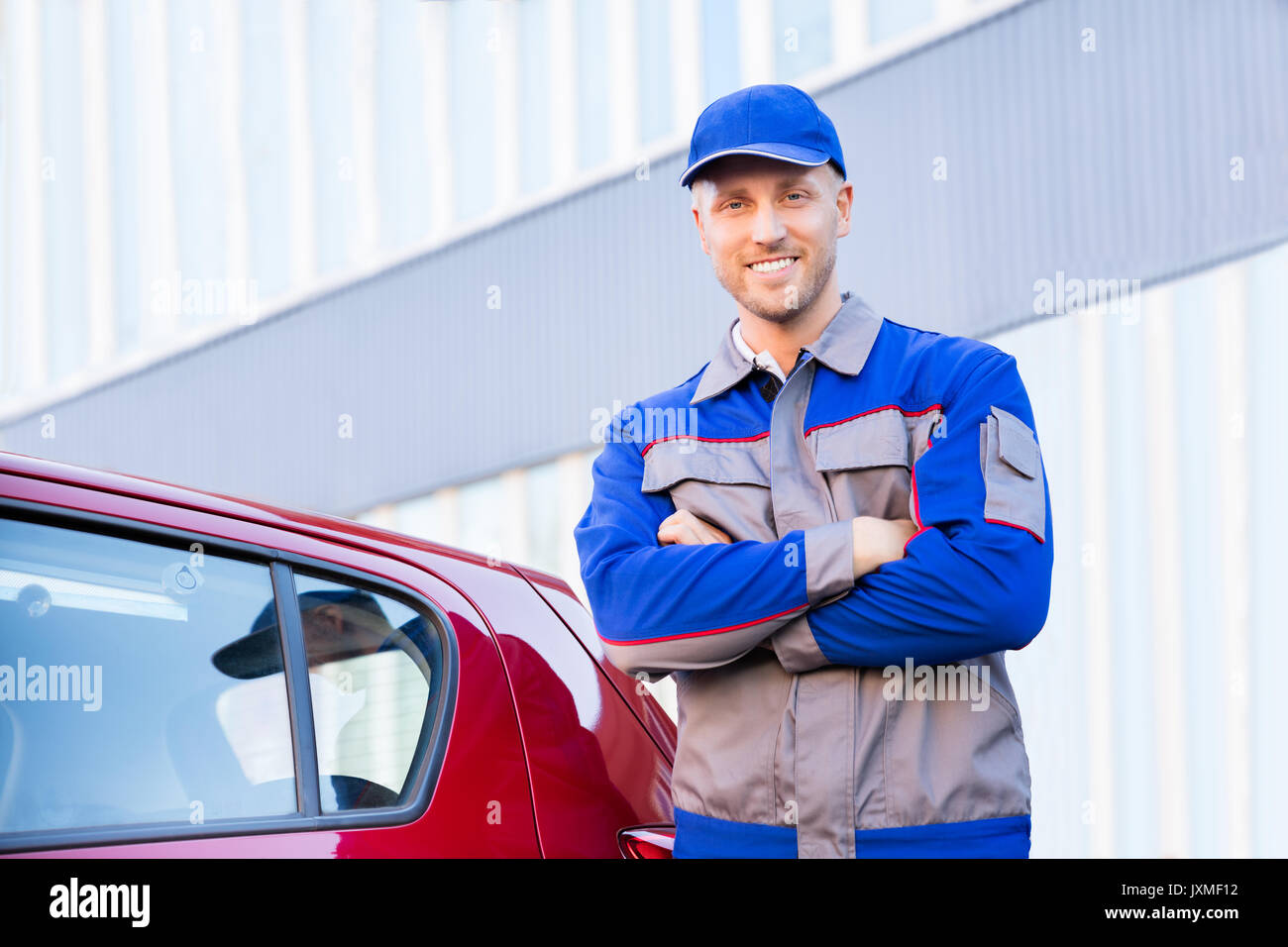 Portrait Of A Happy Young Man Standing Near Car Stock Photo - Alamy