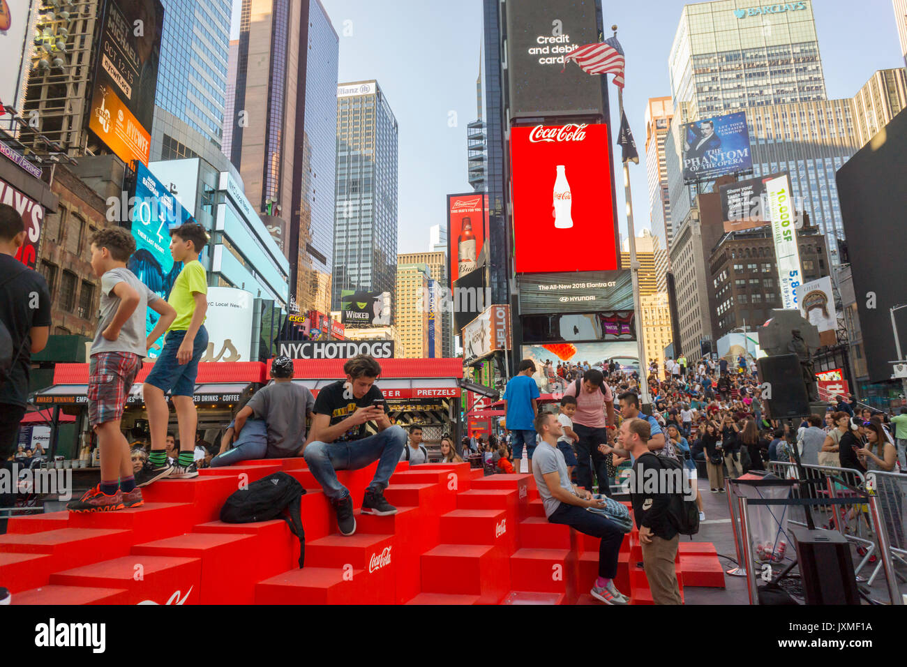 Throngs of tourists pose for selfies in Times Square in New York on the ...